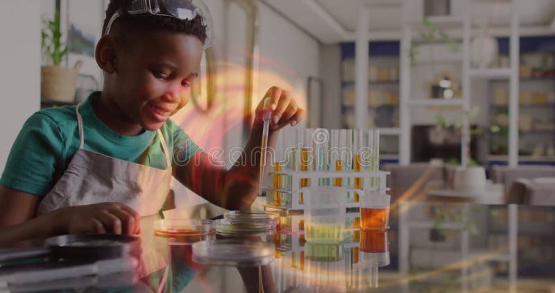 Boy Wearing Apron Using Pipette Moving Orange Liquid on Glass Table ...