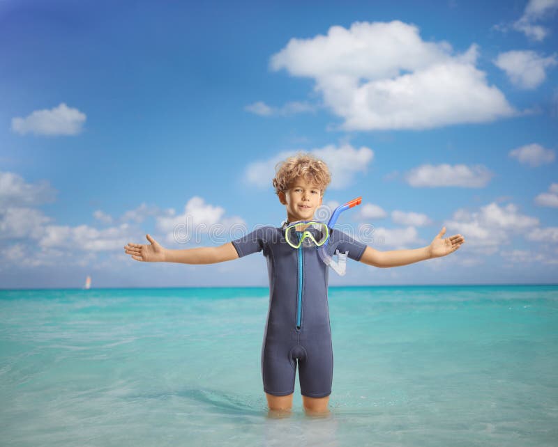 Boy Wearing a Diving Suit and Mask and Standing in the Sea Stock Image ...