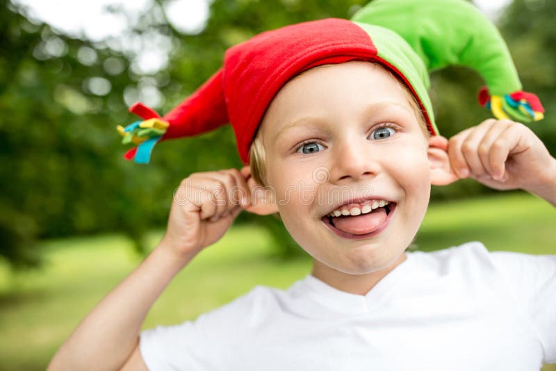 Boy Pulling His Ears and Having Fun Stock Photo - Image of court ...