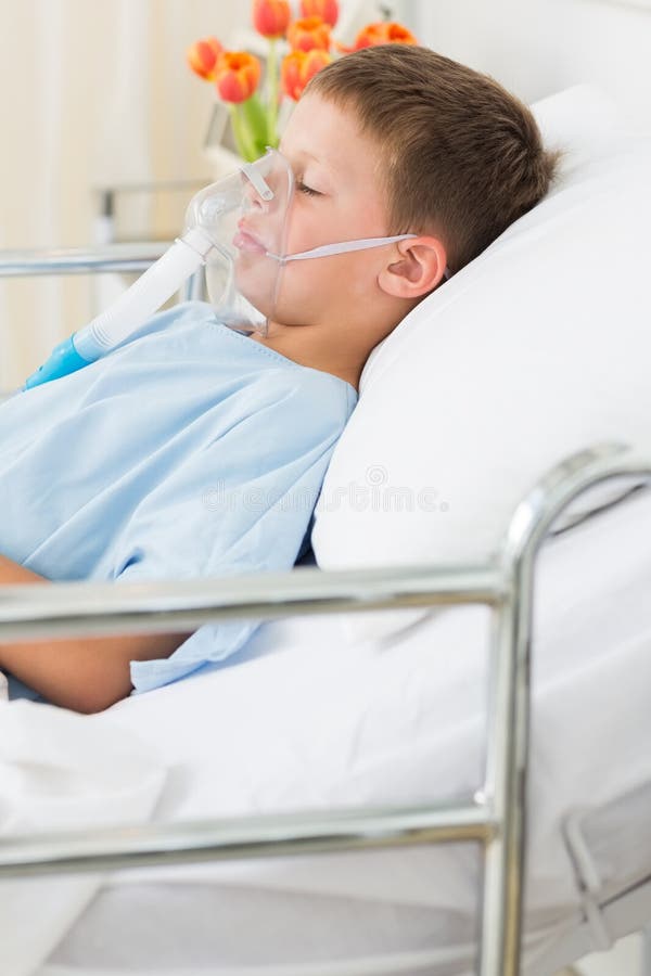Boy Wearing Oxygen Mask in Bed Stock Photo - Image of medical, indoors ...