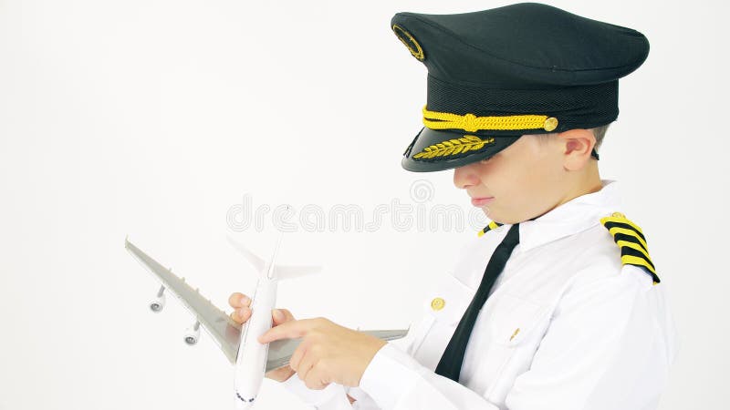 Boy Wearing Pilot`s Uniform Examines Airliner Scale Model Stock Image ...