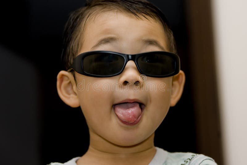 Boy wearing sun-glasses stock image. Image of person - 12509929