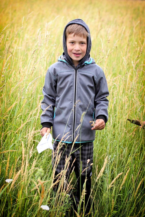Boy Wearing Windcheater in the High Grass Meadow Stock Image - Image of ...
