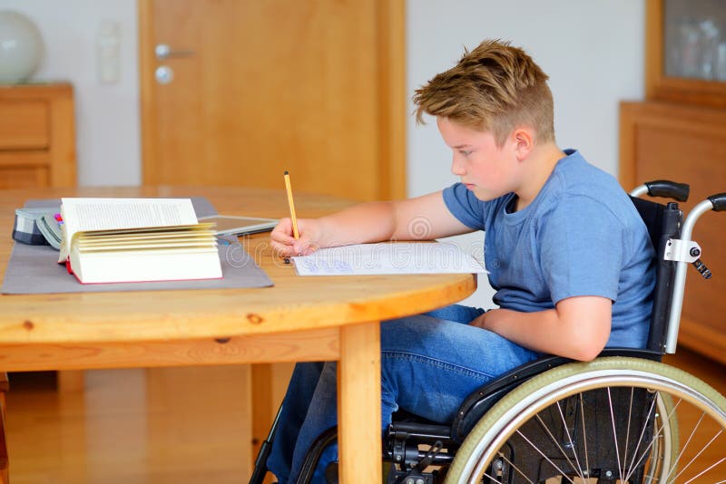 Boy in Wheelchair Doing Homework Stock Image - Image of handicap ...