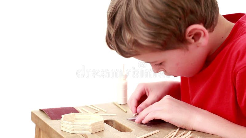 Boy Whet Match Using Sandpaper Which Lies on Table Stock Footage ...