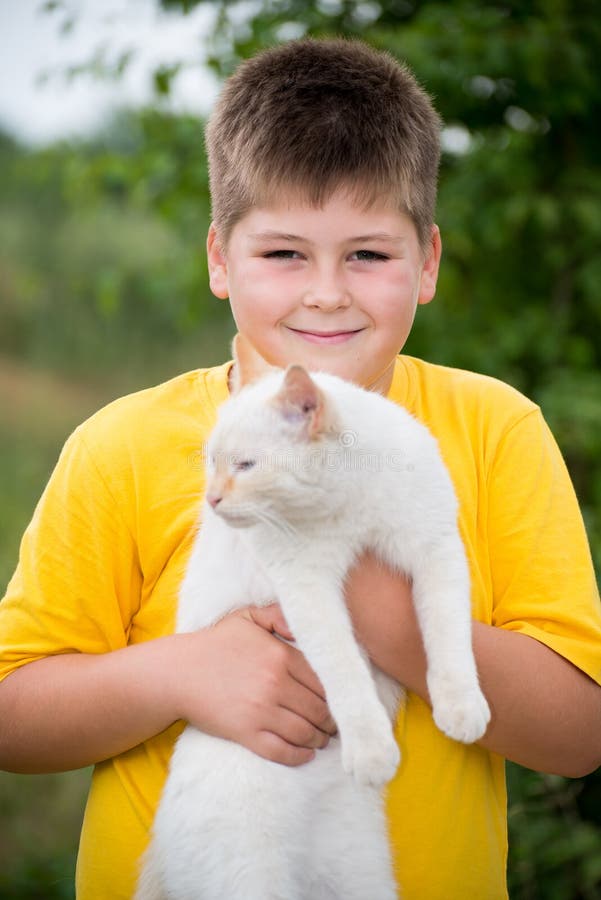 Boy with white cat stock image. Image of nature, white - 33696979