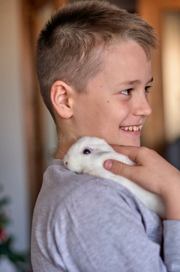 A Boy with a White Rabbit in His Hands Stock Image - Image of person ...