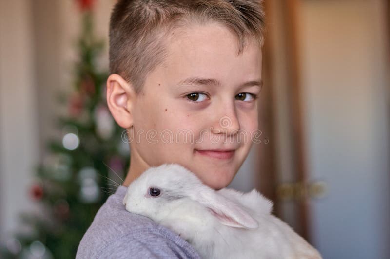 A Boy with a White Rabbit in His Hands Stock Photo - Image of animal ...