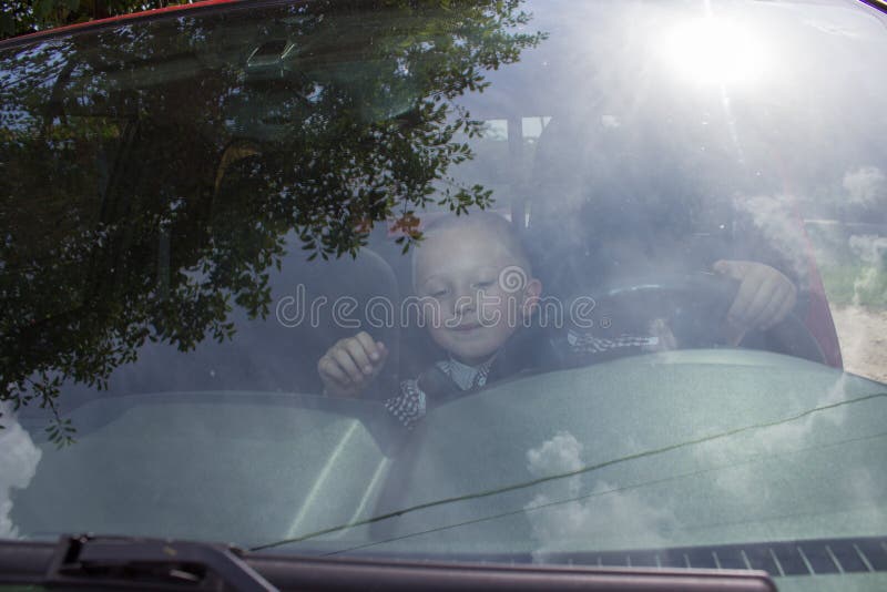 Boy through the windshield stock photo. Image of safety - 74321510