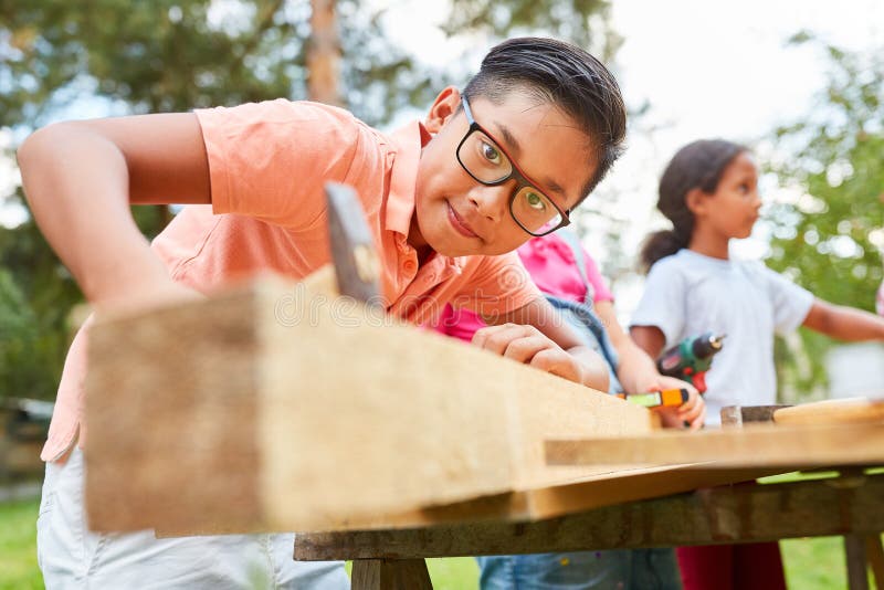 Boy at Work with Hammer and Wood Stock Image - Image of childhood ...