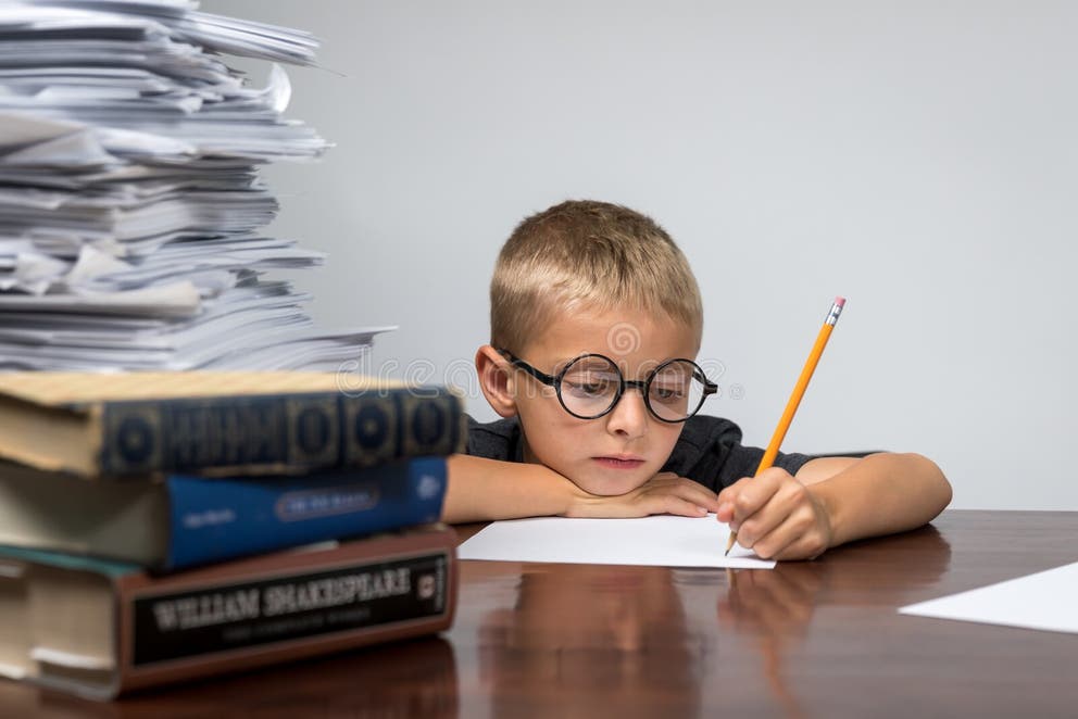 Boy Working on His Stack of Advanced Homework Stock Image - Image of ...