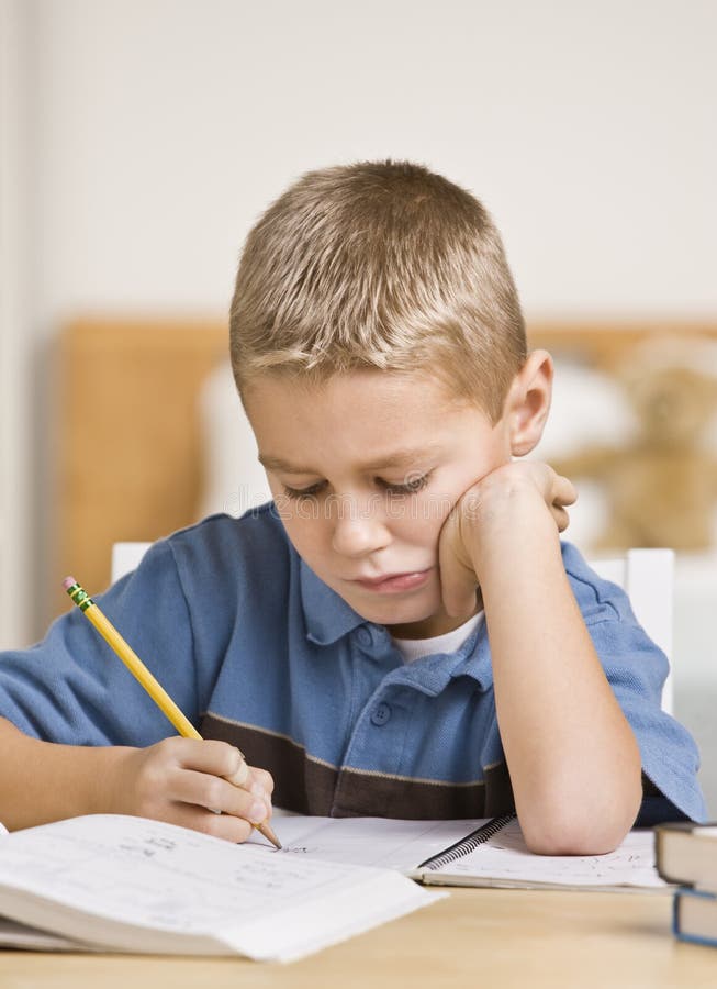 Boy Working on Homework stock image. Image of family - 10196337 Boy Working on Homework stock image. Image of family - 10196337