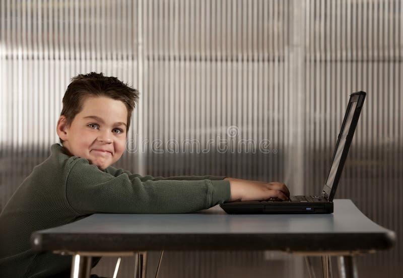Boy Working on a Laptop Computer Stock Photo - Image of write, type ...