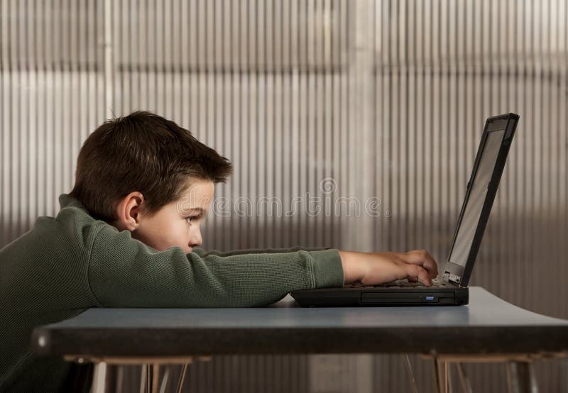 Boy Working on a Laptop Computer Stock Image - Image of male, young ...