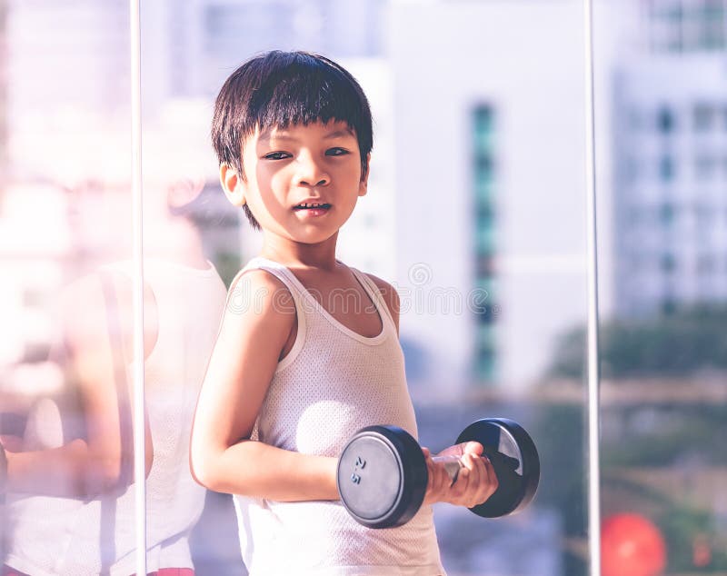 Boy Working Out with Dumbbells in a Gym Stock Image - Image of child ...