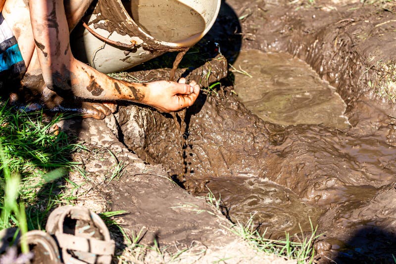 Boy Working and Playing in the Mud Stock Image - Image of hold, food ...