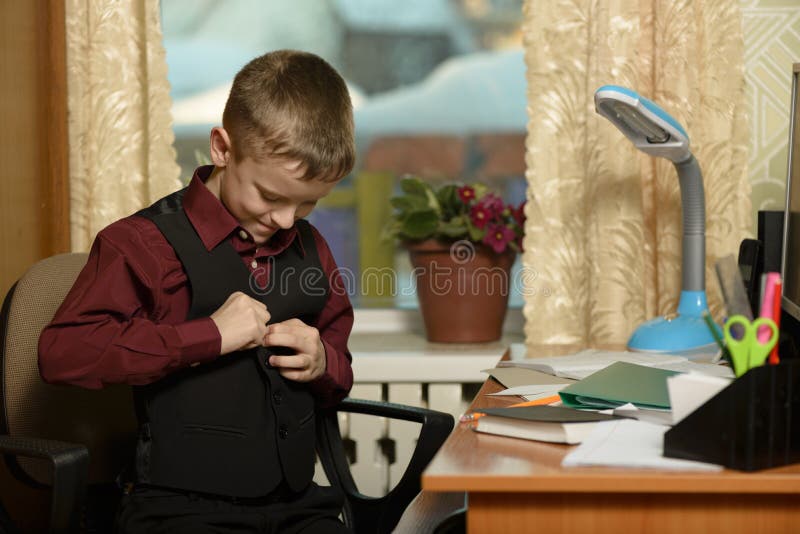 The Boy Works in His Office on a Personal Computer.he Fastens Th Stock ...