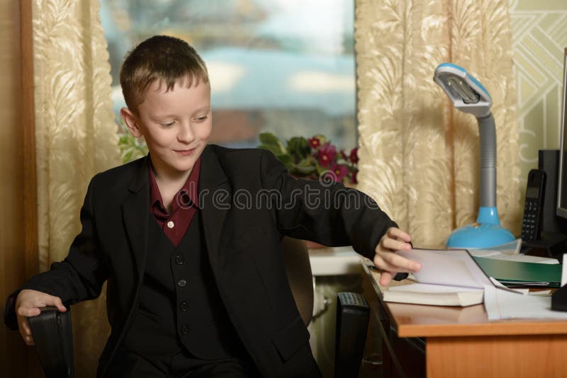 The Boy Works in His Office on a Personal Computer.Sits in an of Stock ...