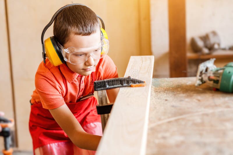Boy in the Workshop Independently Learns To Work Stock Image - Image of ...