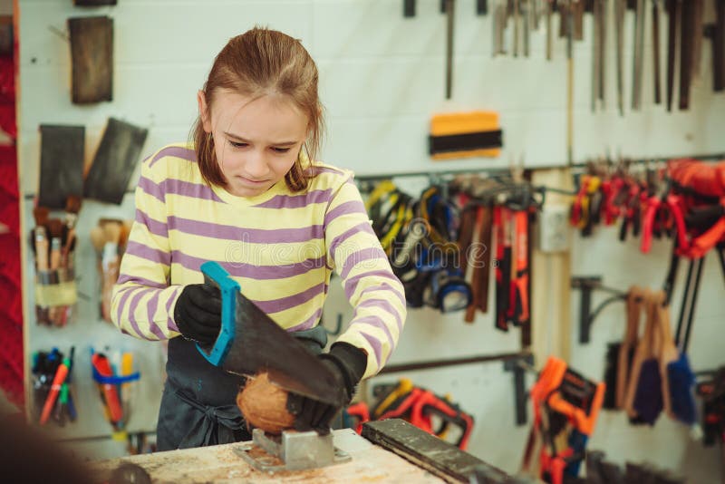 Boy in the Workshop Makes Crafts with Coconut. Young Carpenter Working ...