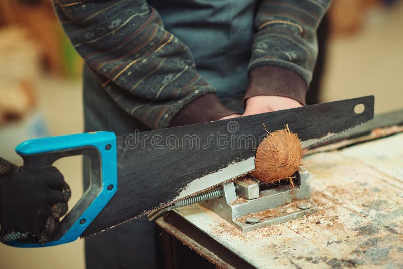 Boy in the Workshop Makes Crafts with Coconut. Young Carpenter Working ...