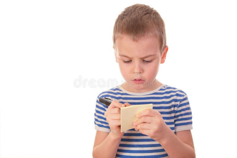 Boy writes on sticker stock image. Image of offspring - 4484585