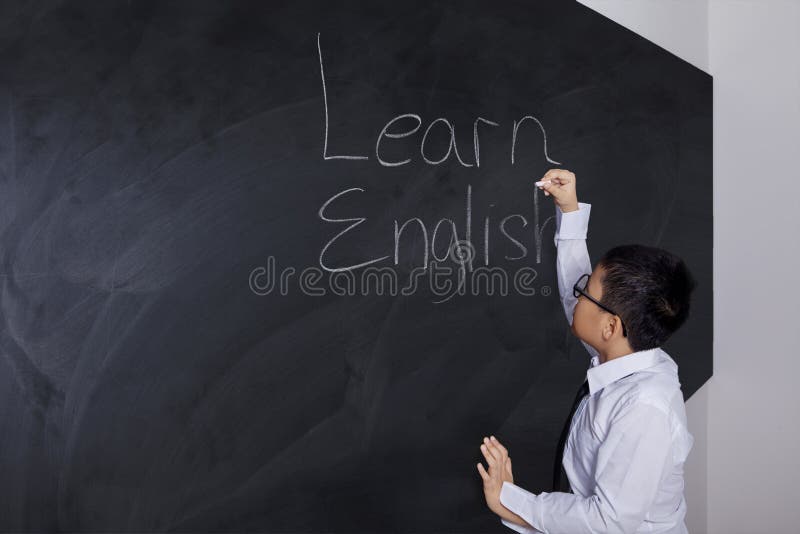 Boy Writes Text of Learn English on Blackboard Stock Image - Image of ...