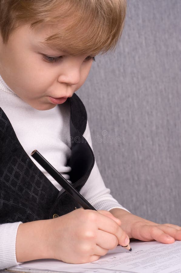 Boy writing stock image. Image of preschool, looking - 12619833