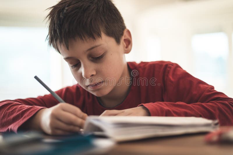 Boy writing stock image. Image of school, horizontal - 48720425