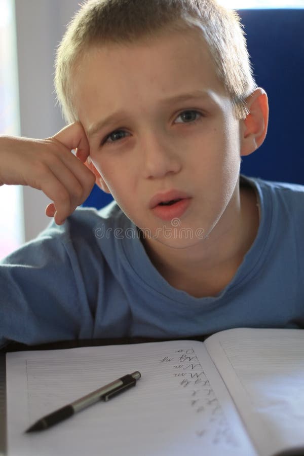 Boy writing homework stock image. Image of think, write - 781485