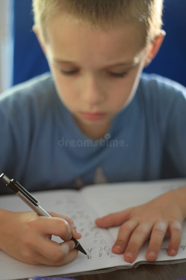 Boy writing homework stock photo. Image of english, homework - 781496