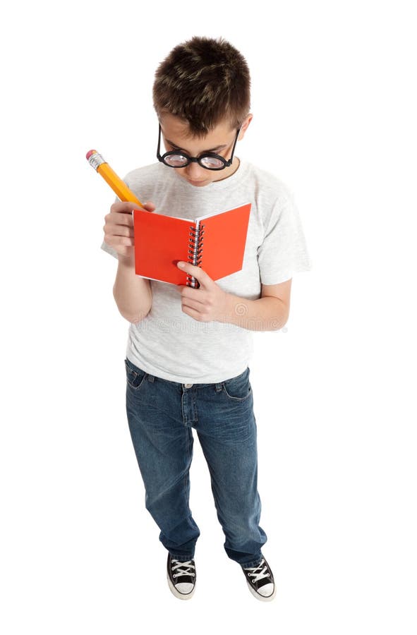 Boy writing in notebook stock image. Image of male, full - 11577147