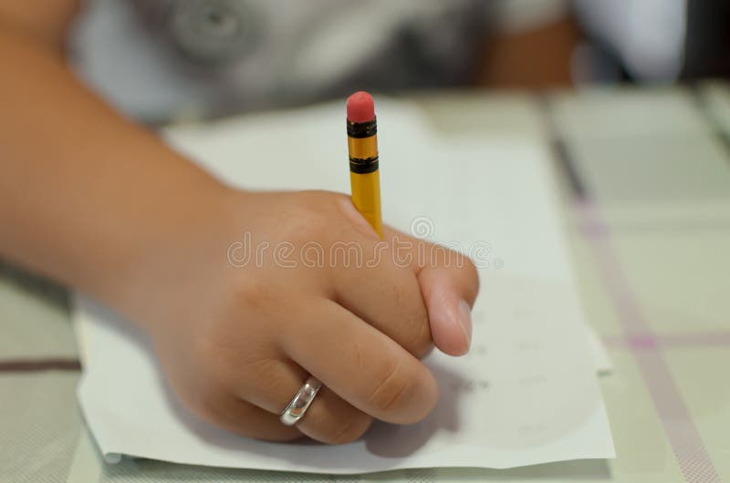 Boy writing on a paper stock photo. Image of difficult - 119083338