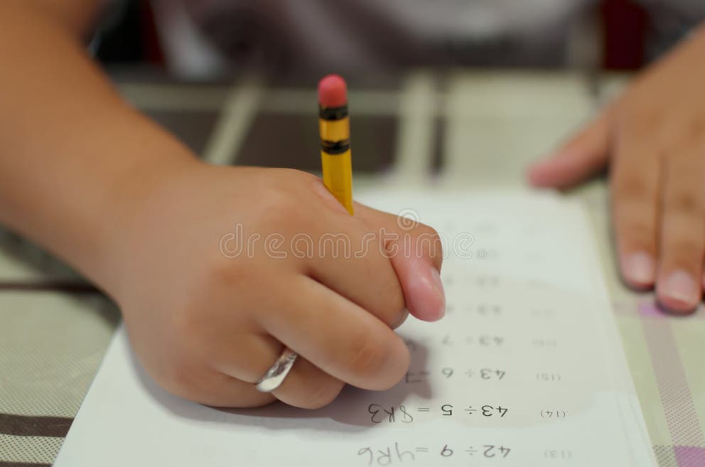 Boy writing on a paper stock photo. Image of answer - 121167218