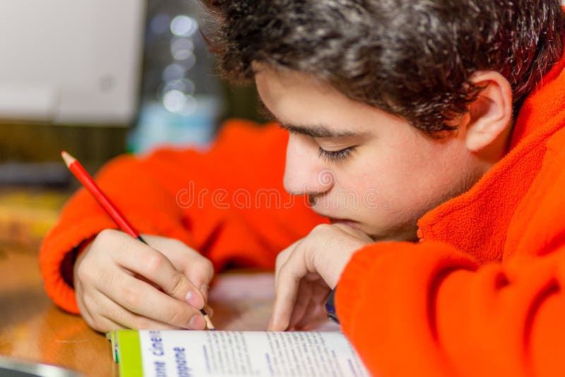 Boy Writing with Red and Blue Pencil Stock Image - Image of focused ...