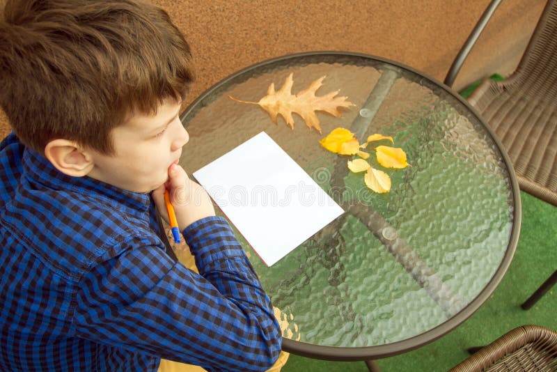 Boy is Doing Homework Outdoors Stock Photo - Image of children, page ...