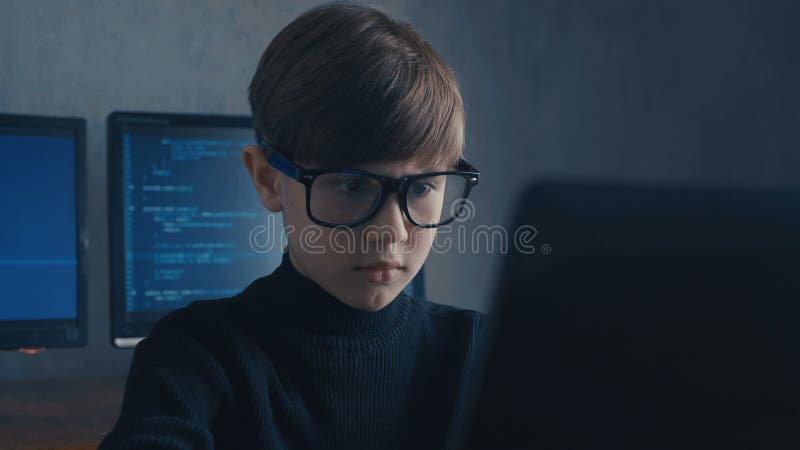 Boy Wunderkind Hacker Hacks Computer Systems. in Data Center with Maps ...