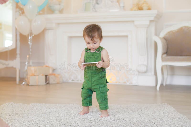 Boy 1 Year Sitting on the Carpet in a Bright Room Stock Image - Image ...