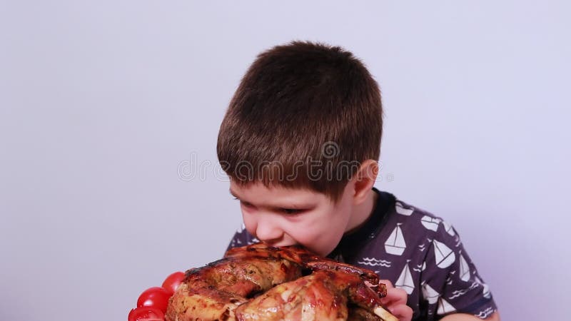 A Boy of 3-4 Years Old Eats Rabbit Meat. Proper Nutrition for Children ...
