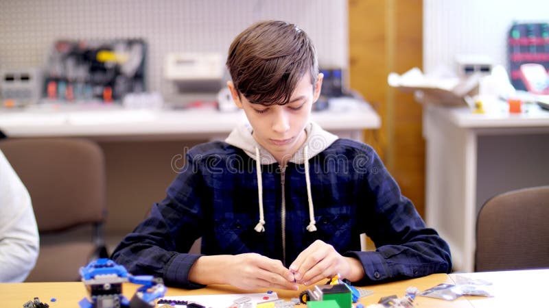 The Boy of 12 Years, Plays in the Designer from Cubes, Plates, Circuits ...