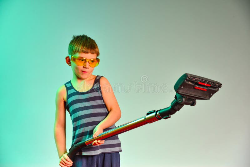 Boy in Yellow Goggles Holding a Vacuum Cleaner Handle Stock Photo ...