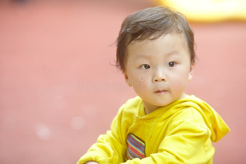 Boy in yellow stock photo. Image of china, child, chongqing - 53133050