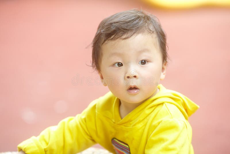 Boy in yellow stock photo. Image of chongqing, hair, playgroud - 53133074