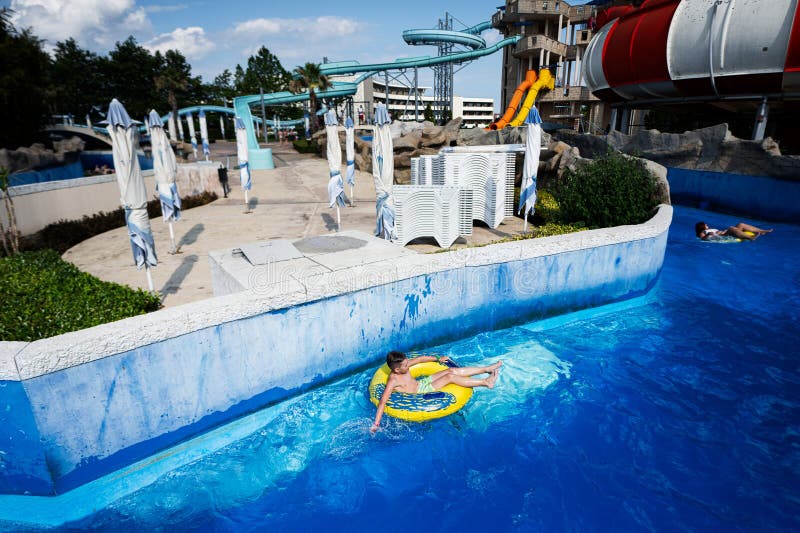 Boy in a Yellow Ring in a Blue Water Park Stock Image - Image of sport ...