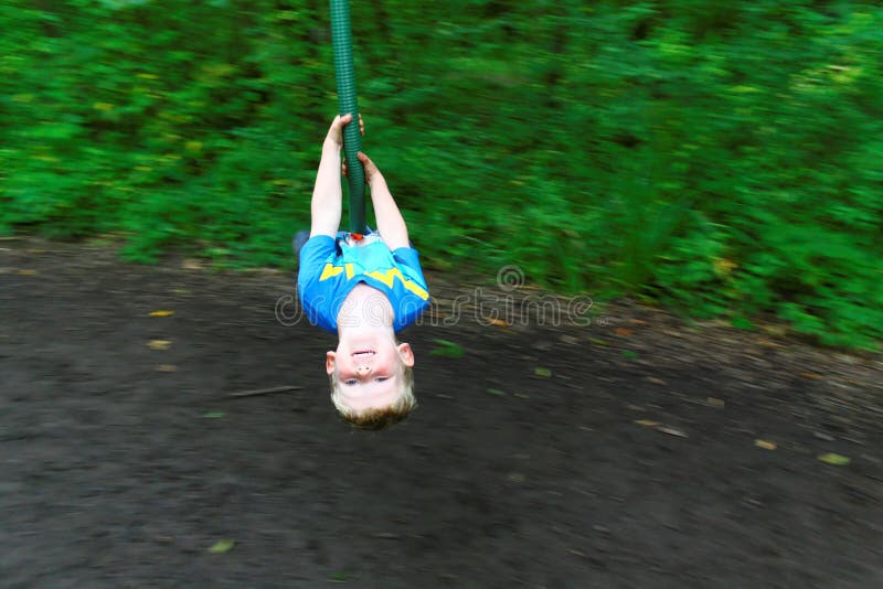 Boy on Zip Wire Having Fun stock photo. Image of outdoor - 56274662