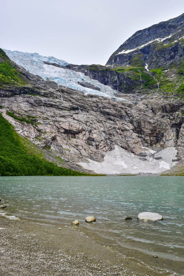 The Boyabreen Glacier in Norway. the Lake with Clear Water Stock Photo ...