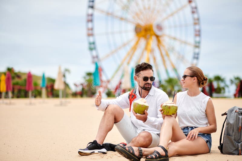 Boyfriend and Girlfriend Resting on Beach Stock Photo - Image of ...