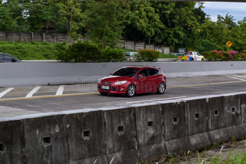 Red Ford Focus Hatchback Driving Fast on Trans Jawa Highway Toll Road ...