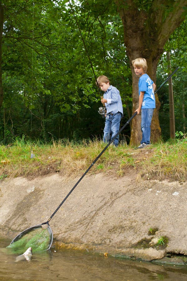 Boys catching fish stock image. Image of childhood, catching - 27342049