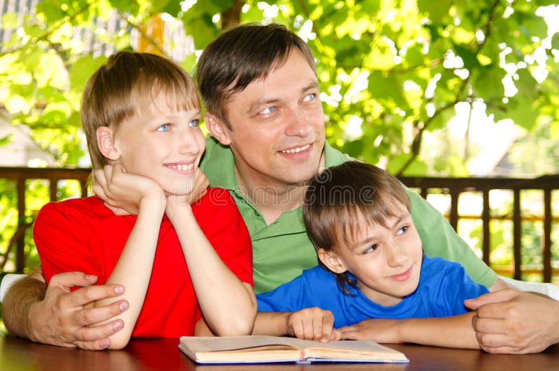 Boys and dad reading stock image. Image of nice, human - 20523513